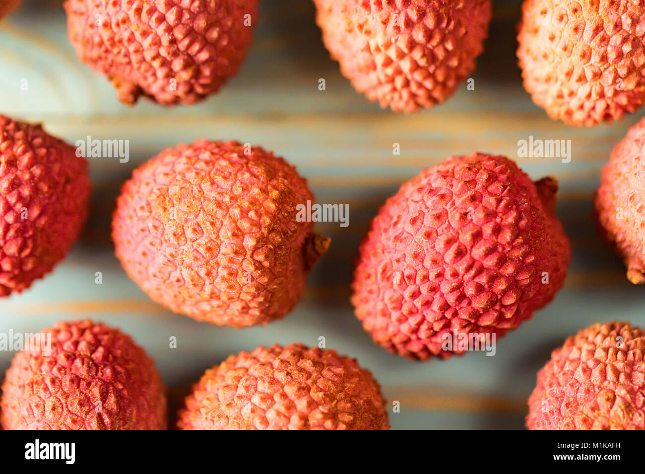Top view lychee fruit on wooden background Stock Photo - Alamy