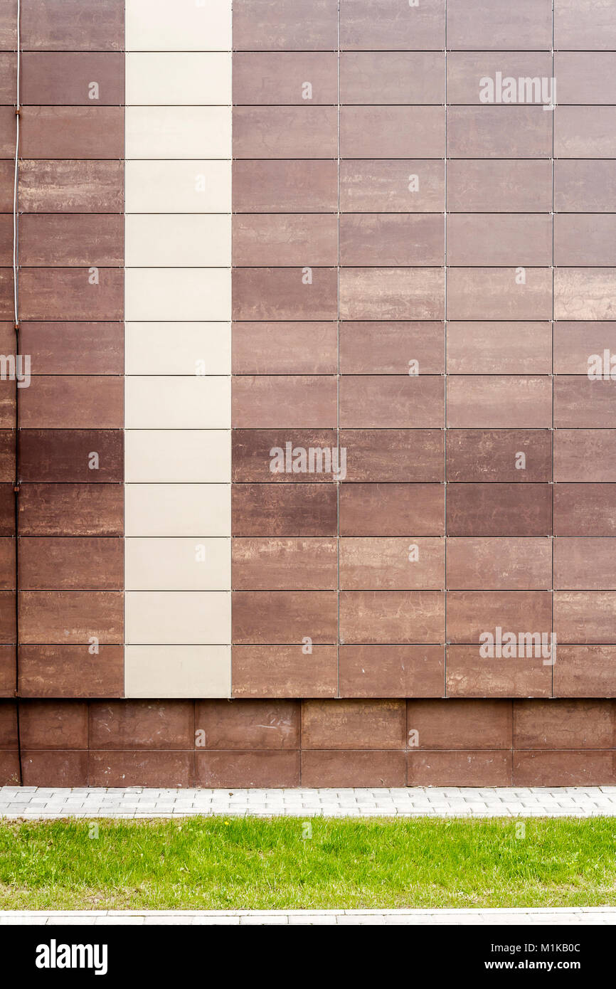 Modern beige metal facade tiles wall and a ground. Abstract ...