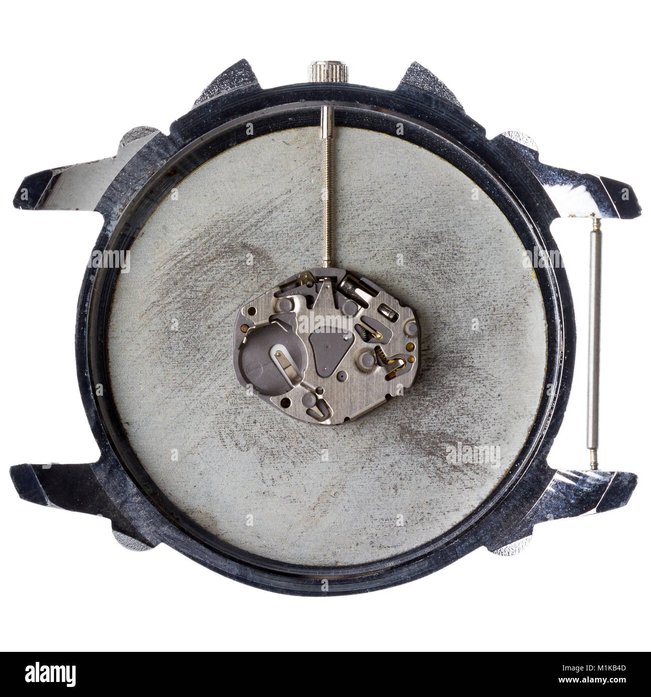 Quartz watch movement in old grungy clock isolated on white background ...