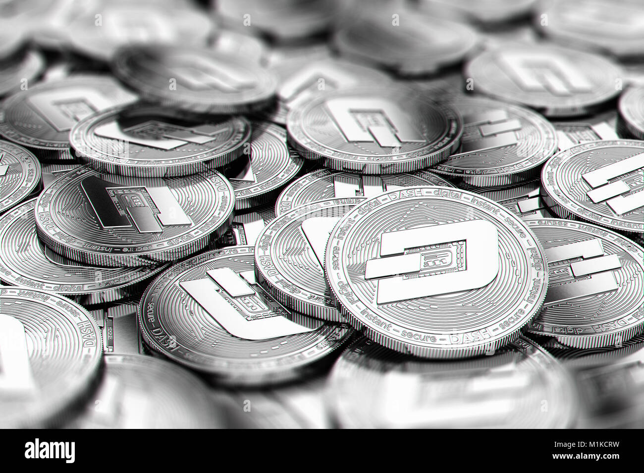 Stack of silver Dash coins in blurry closeup with copy space above in ...