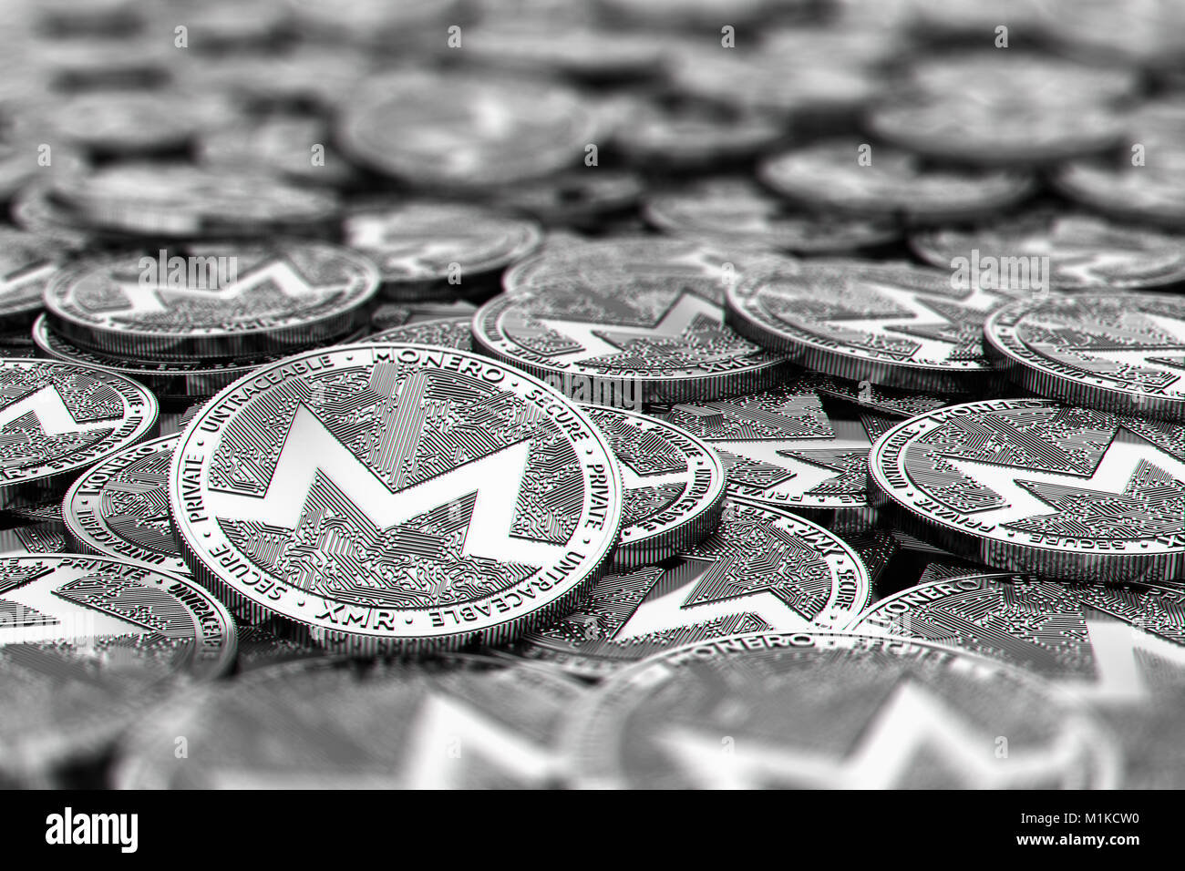 Stack of silver Monero coins in blurry closeup with copy space above in ...