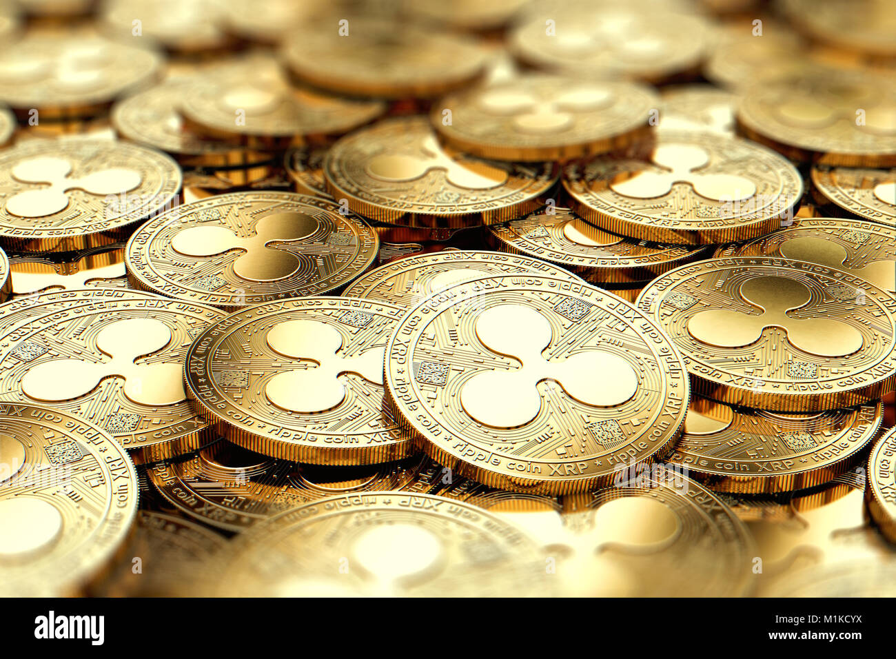 Stack of golden Ripple XRP coins in blurry closeup with copy space ...