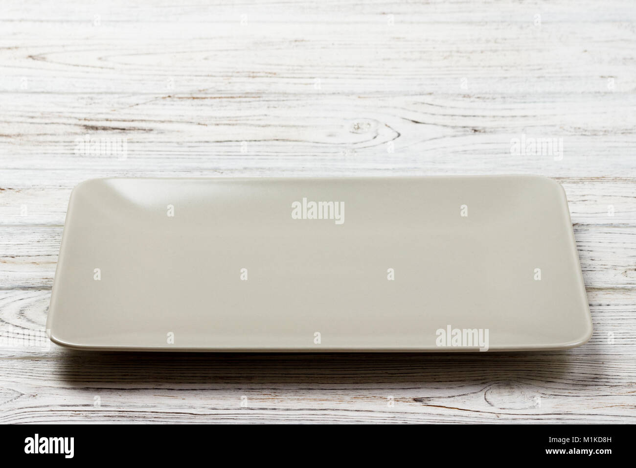 empty rectangular Plate on wooden table background Stock Photo - Alamy