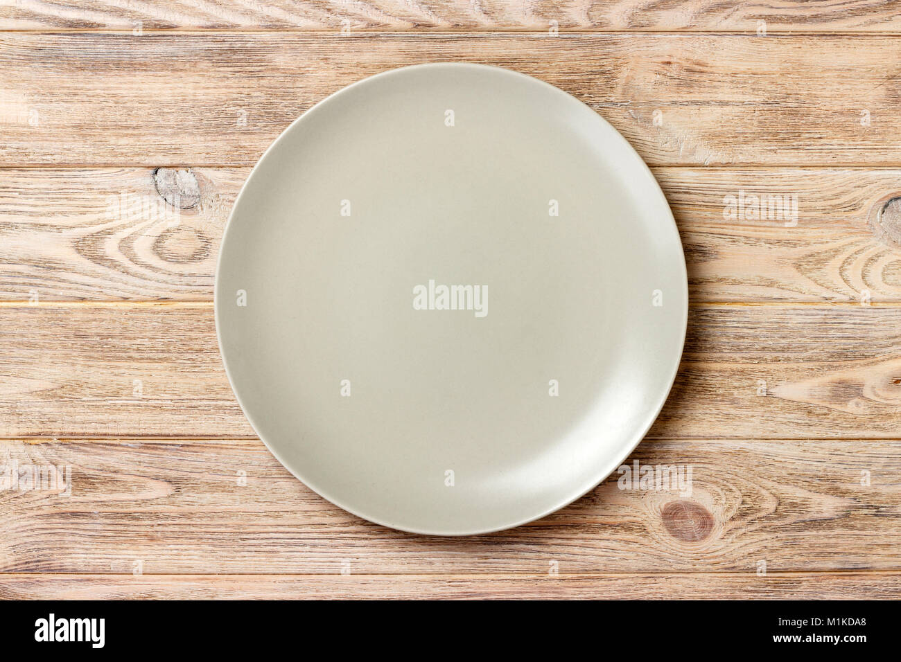 Top view empty matte plate on rustic wooden table. Top view Stock Photo ...