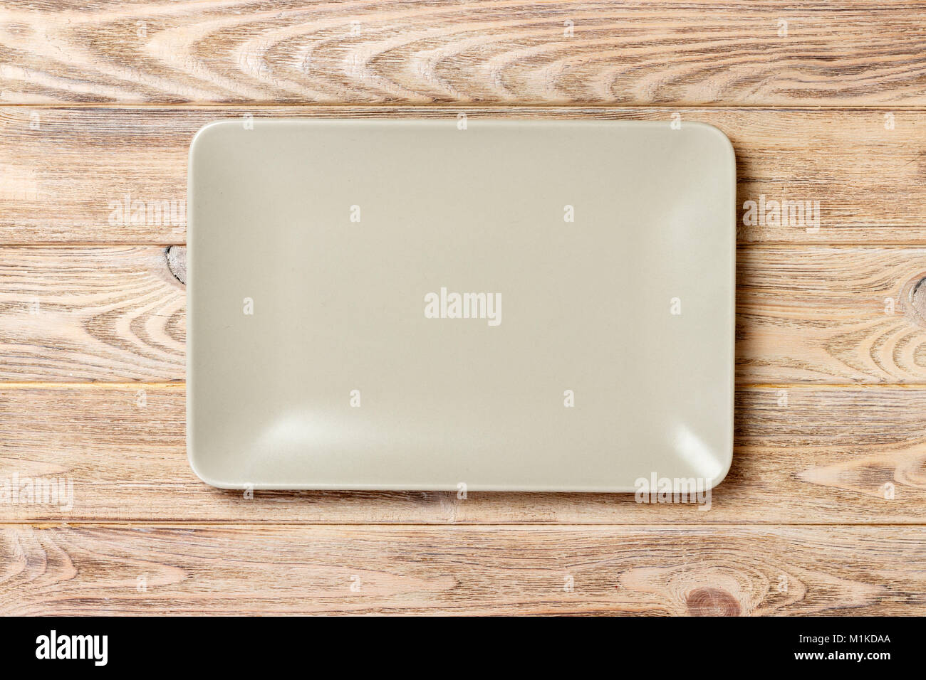 empty rectangular Plate on wooden table background Stock Photo - Alamy