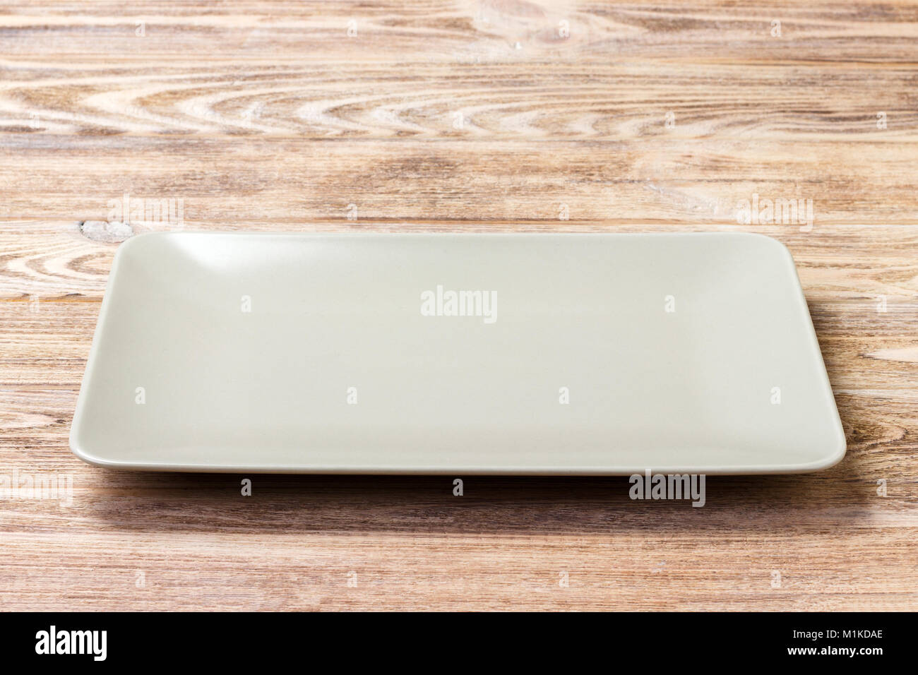 Blank rectangular plate on wooden background. top view Stock Photo - Alamy