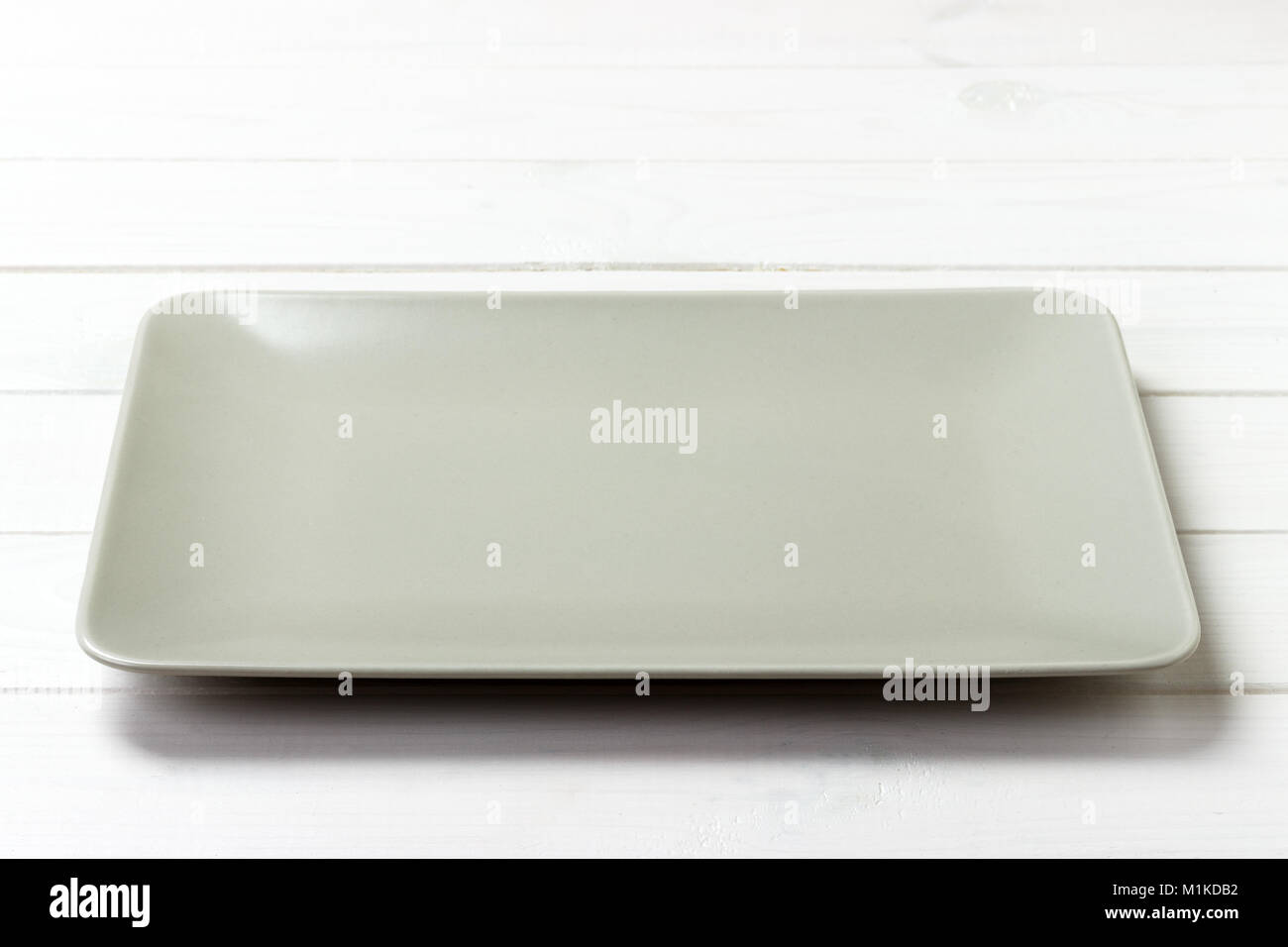 empty rectangular Plate on wooden table background Stock Photo - Alamy