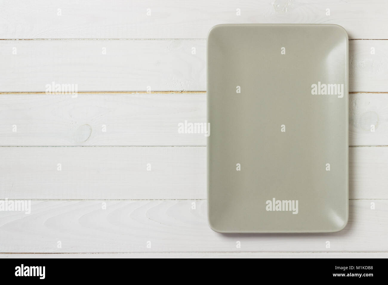 empty rectangular Plate on wooden table background Stock Photo - Alamy