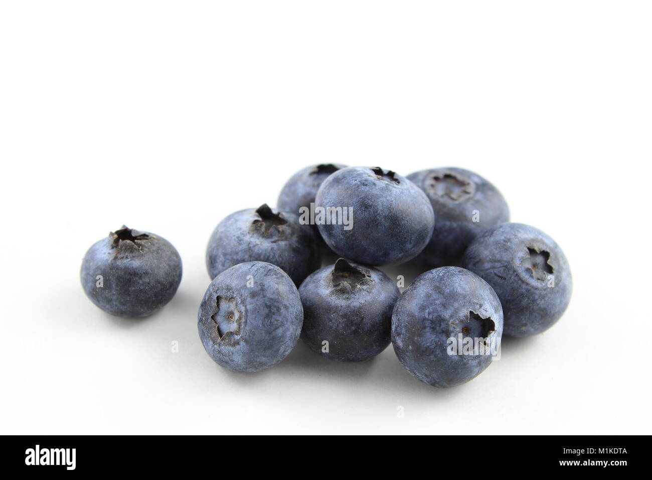 composition of fresh blueberry fruits isolated on a white background ...
