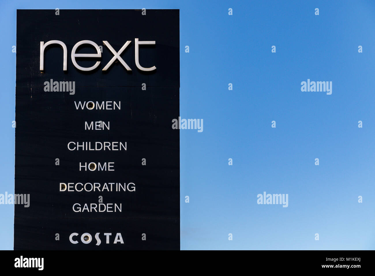 Large black next sign hi-res stock photography and images - Alamy