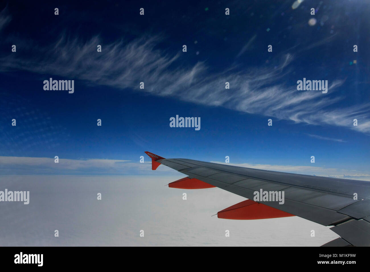 Wing of an airplane in the sky Stock Photo - Alamy