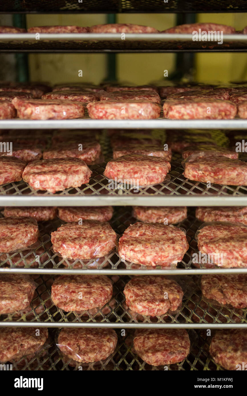 Close up images of burger patties on a rack in a butchery Stock Photo ...