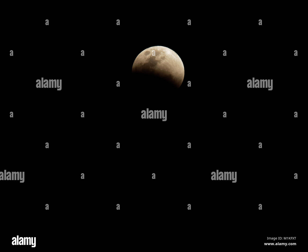 Super blue blood moon with partial lunar eclipse over dark sky ...