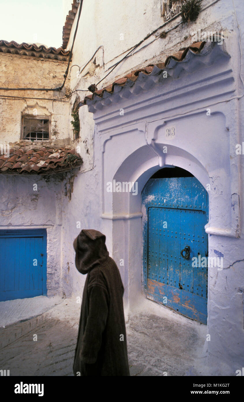 Morocco. Chechaouen, south of Tetouan. Rif mountains. Ancient door. Man ...