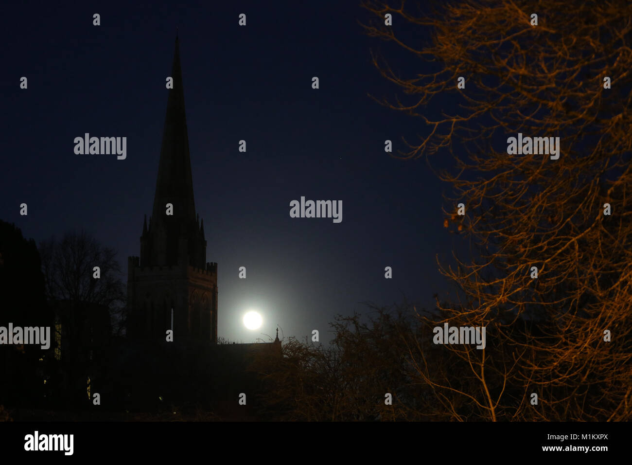 Chichester, West Sussex, UK. The moon pictured next to Chichester ...