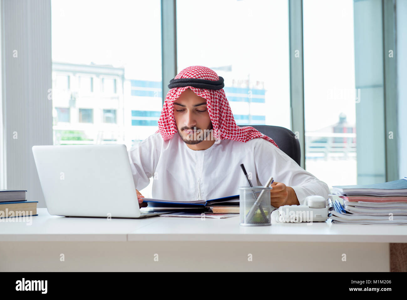 Arab businessman working in the office Stock Photo - Alamy