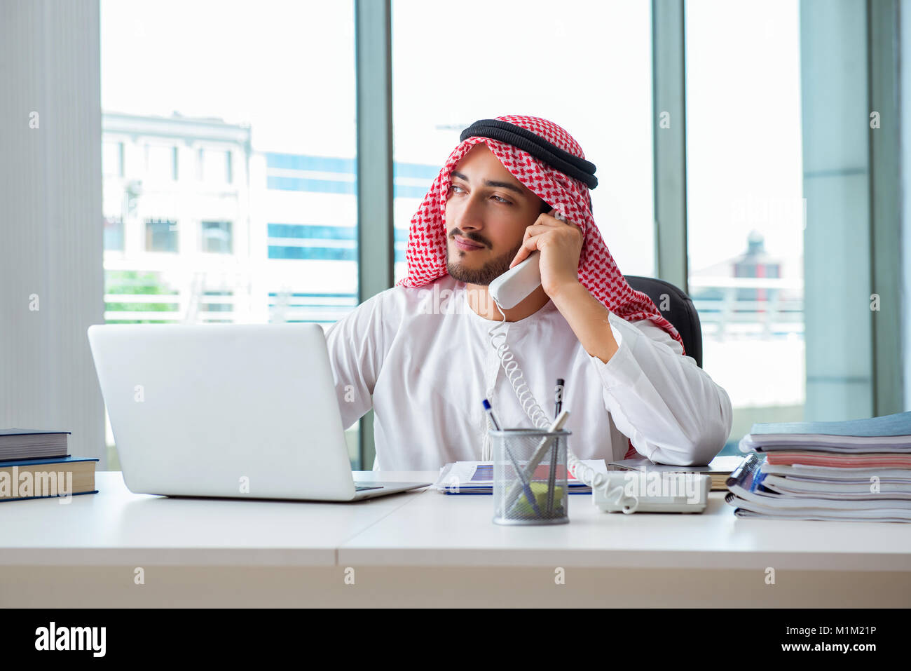 Arab businessman working in the office Stock Photo - Alamy