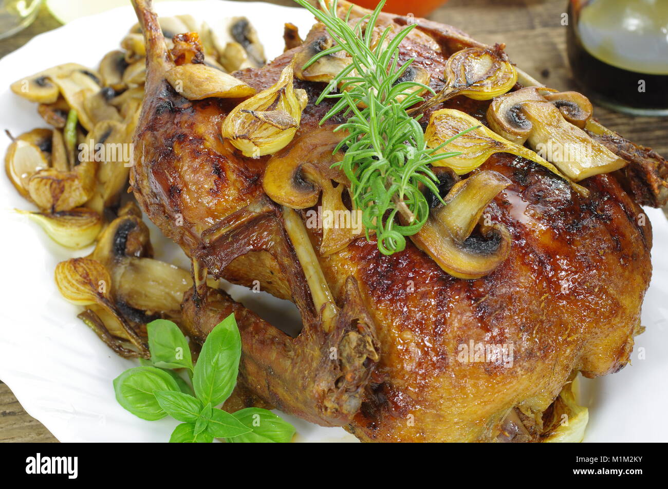 whole roast honey duck on white plate Stock Photo - Alamy