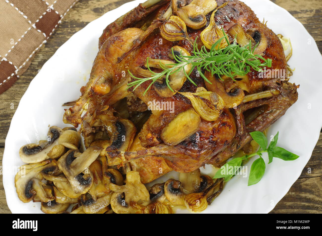 whole roast honey duck on white plate Stock Photo - Alamy