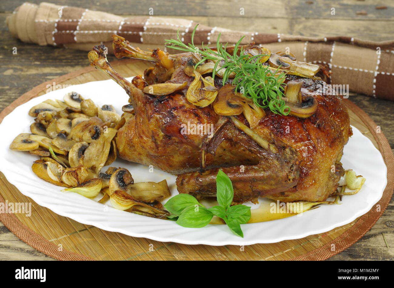 whole roast honey duck on white plate Stock Photo - Alamy