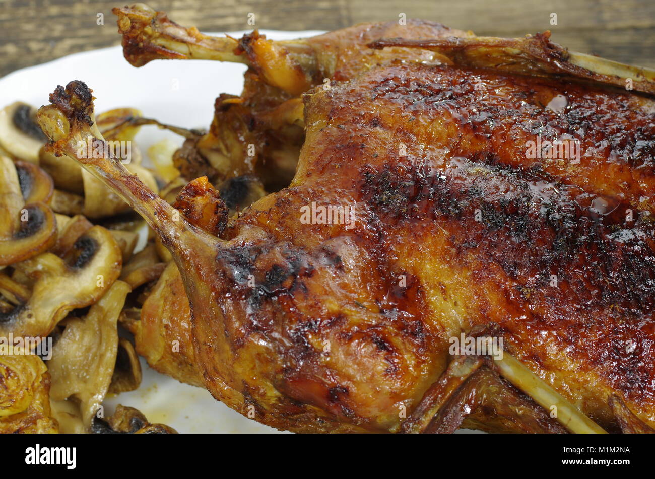 whole roast honey duck on white plate Stock Photo - Alamy