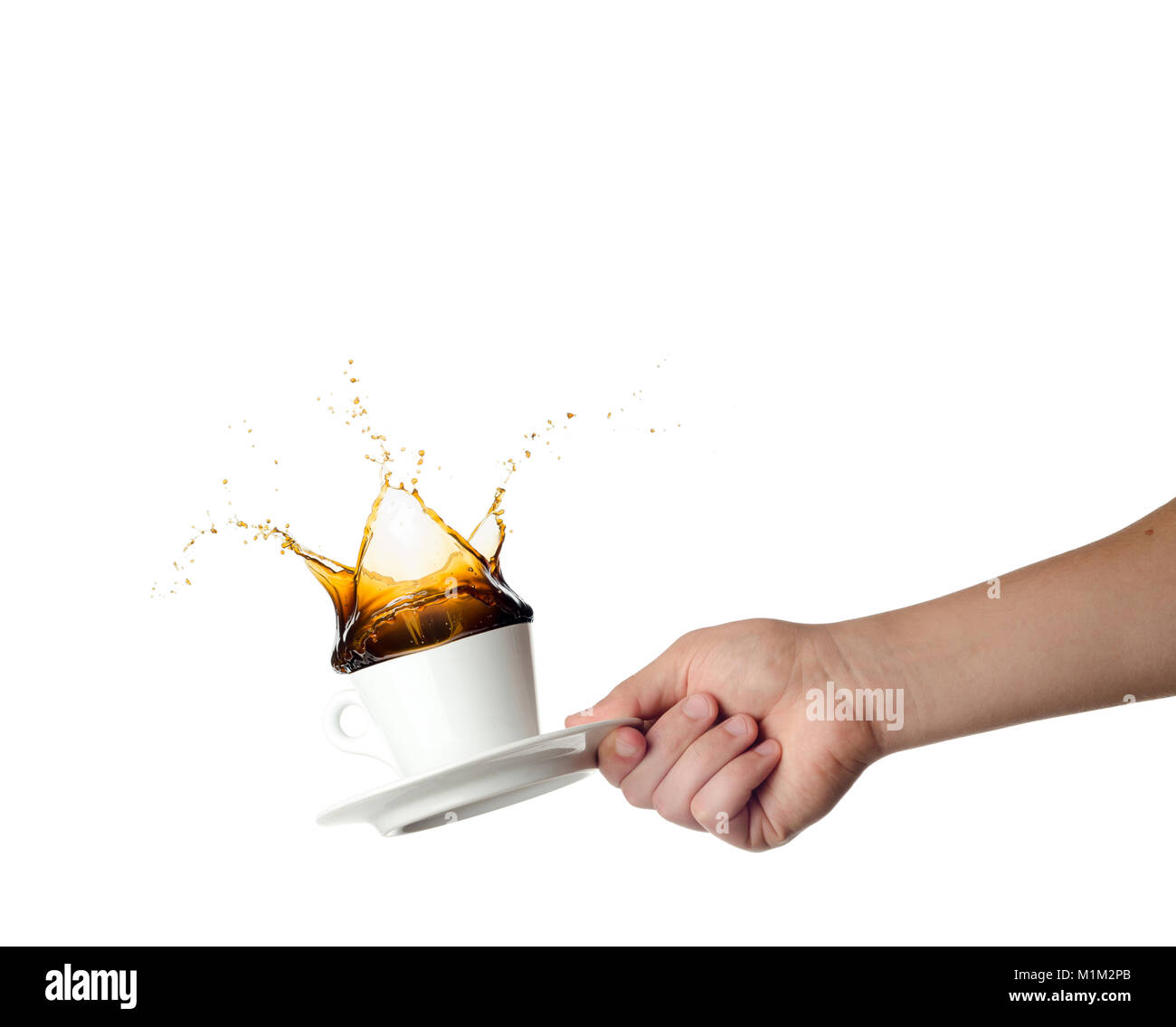 Hand holding cup with splashing coffee isolated on white background ...