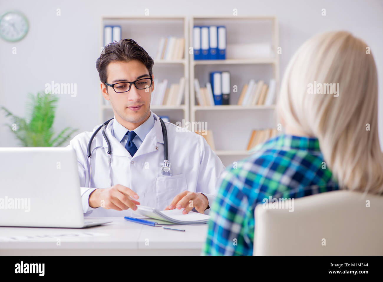 Patient visiting doctor for medical check-up in hospital Stock Photo ...