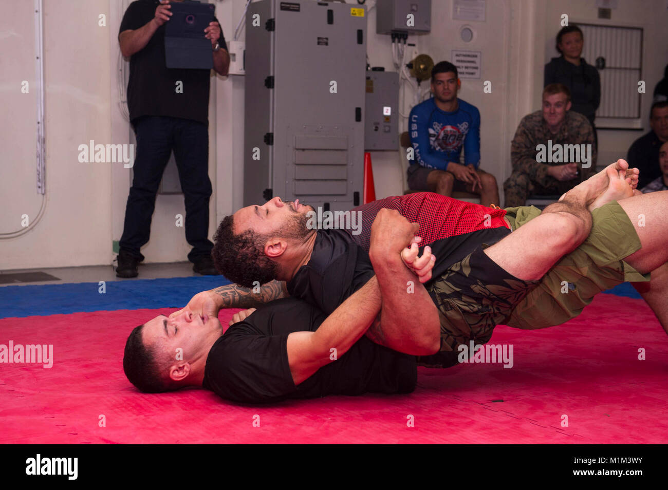 PACIFIC OCEAN (Jan. 27, 2018) Marine Corps Cpl. Heber Matute, top, and ...