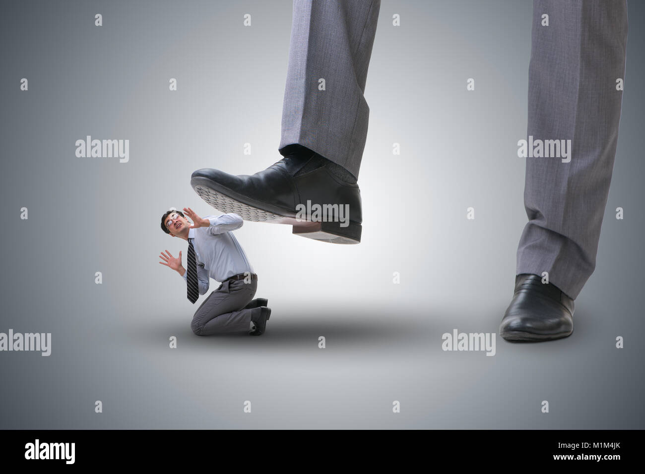 Bad angry boss stamping on employee in business concept Stock Photo - Alamy