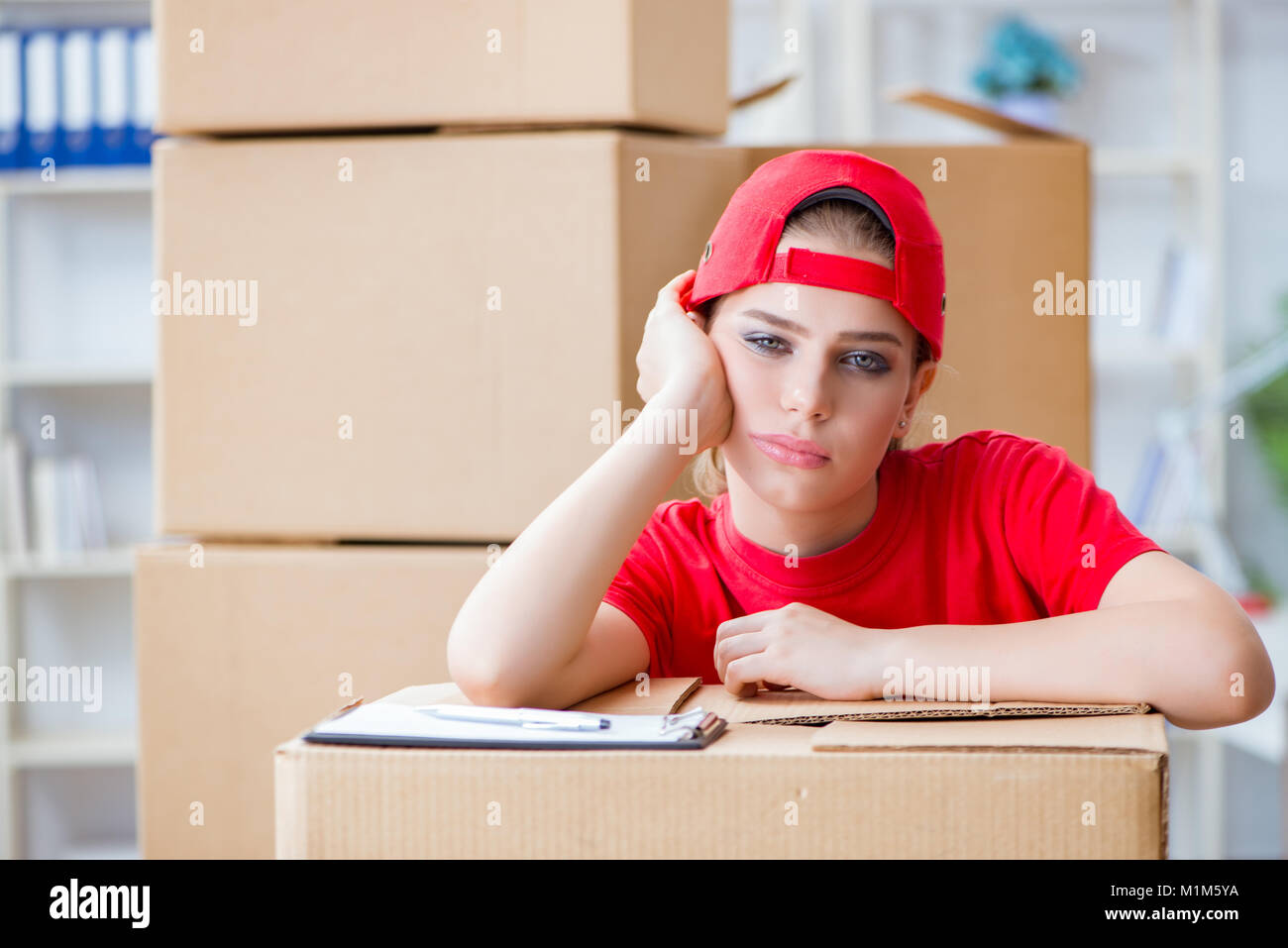 Young woman delivering boxes of personal effects Stock Photo - Alamy