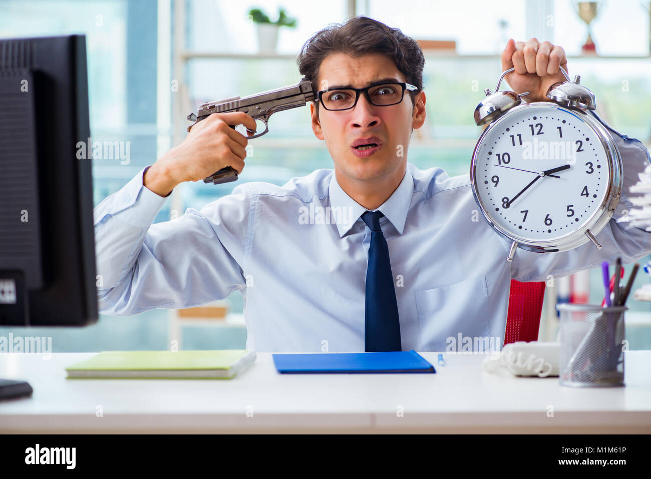 Angry businessman with gun thinking of committing suicide Stock Photo ...