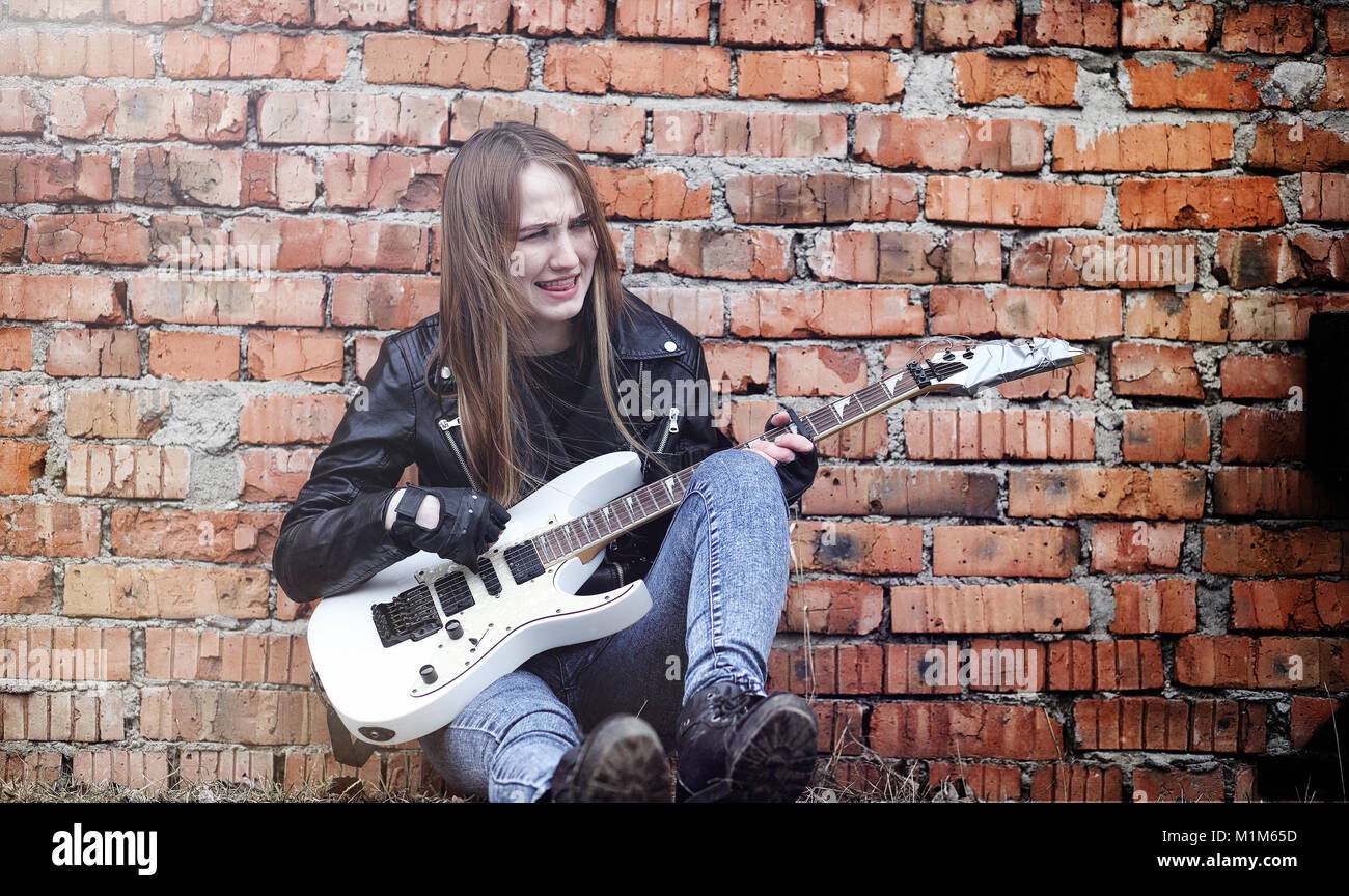 Beautiful young girl rocker with electric guitar. A rock musicia Stock ...