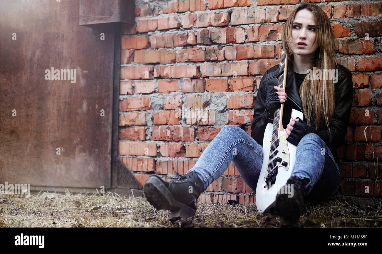 Beautiful young girl rocker with electric guitar. A rock musicia Stock ...