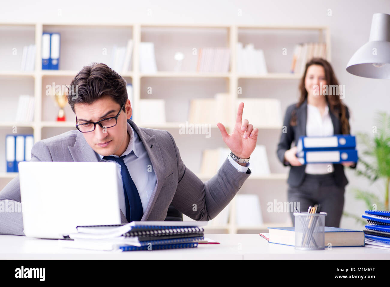 Angry boss unhappy with female employee performance Stock Photo - Alamy