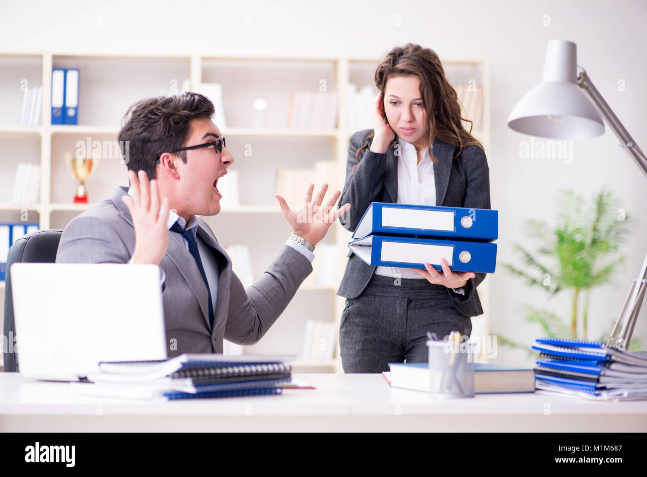 Angry boss unhappy with female employee performance Stock Photo - Alamy