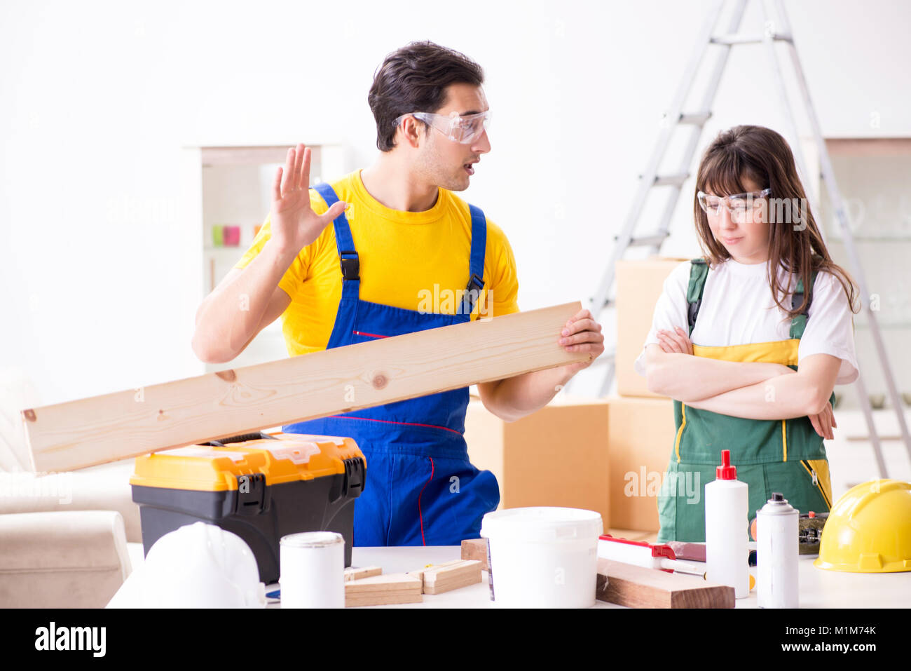 Man woman in overalls discussing hi-res stock photography and images ...
