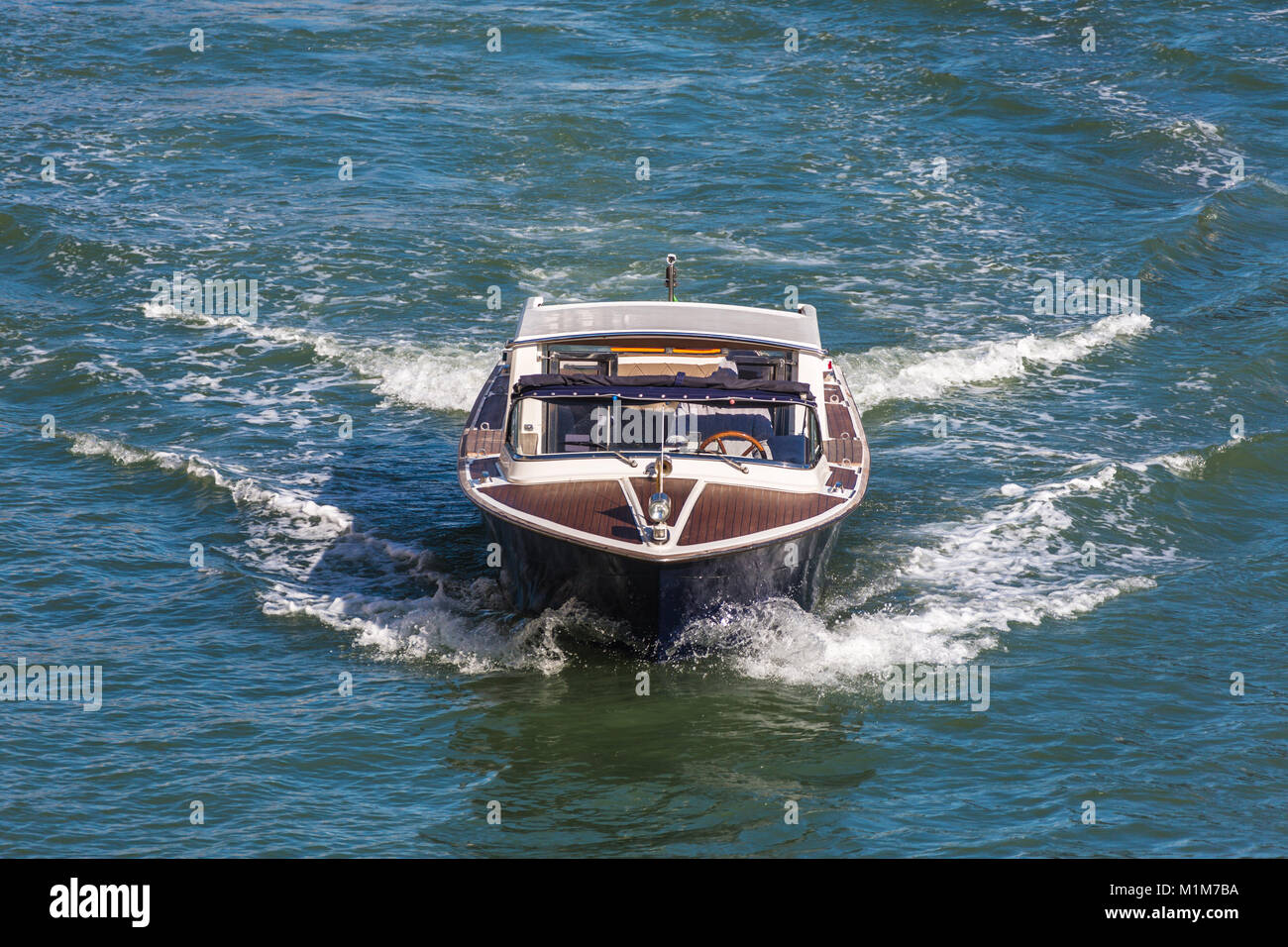 Boat floating in the sea closeup Stock Photo - Alamy
