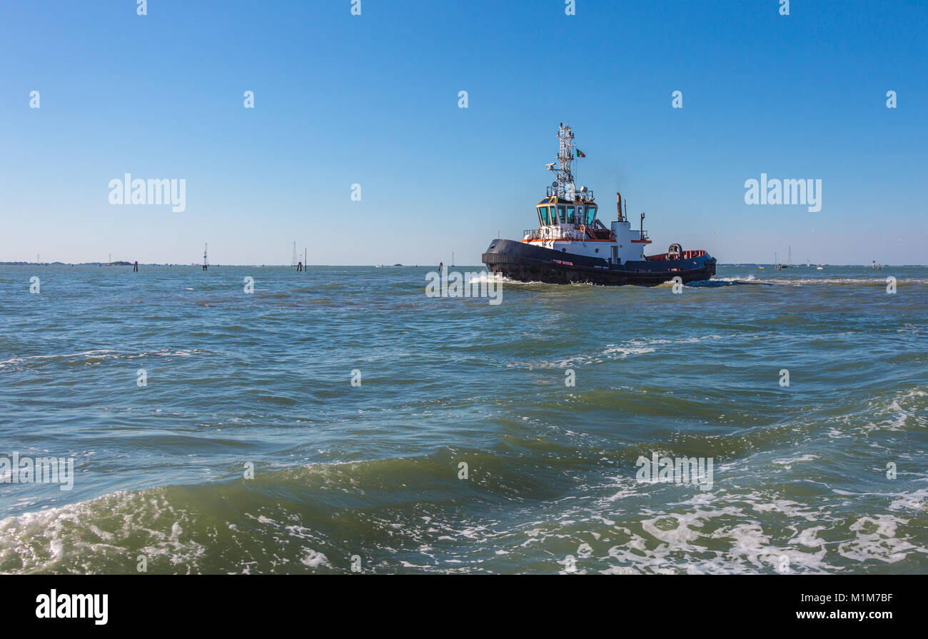 boat is floating along the coast Stock Photo - Alamy
