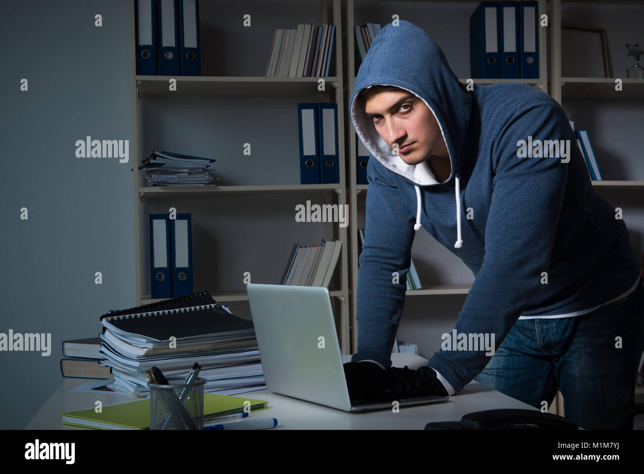 Young hacker hacking into computer at night Stock Photo - Alamy