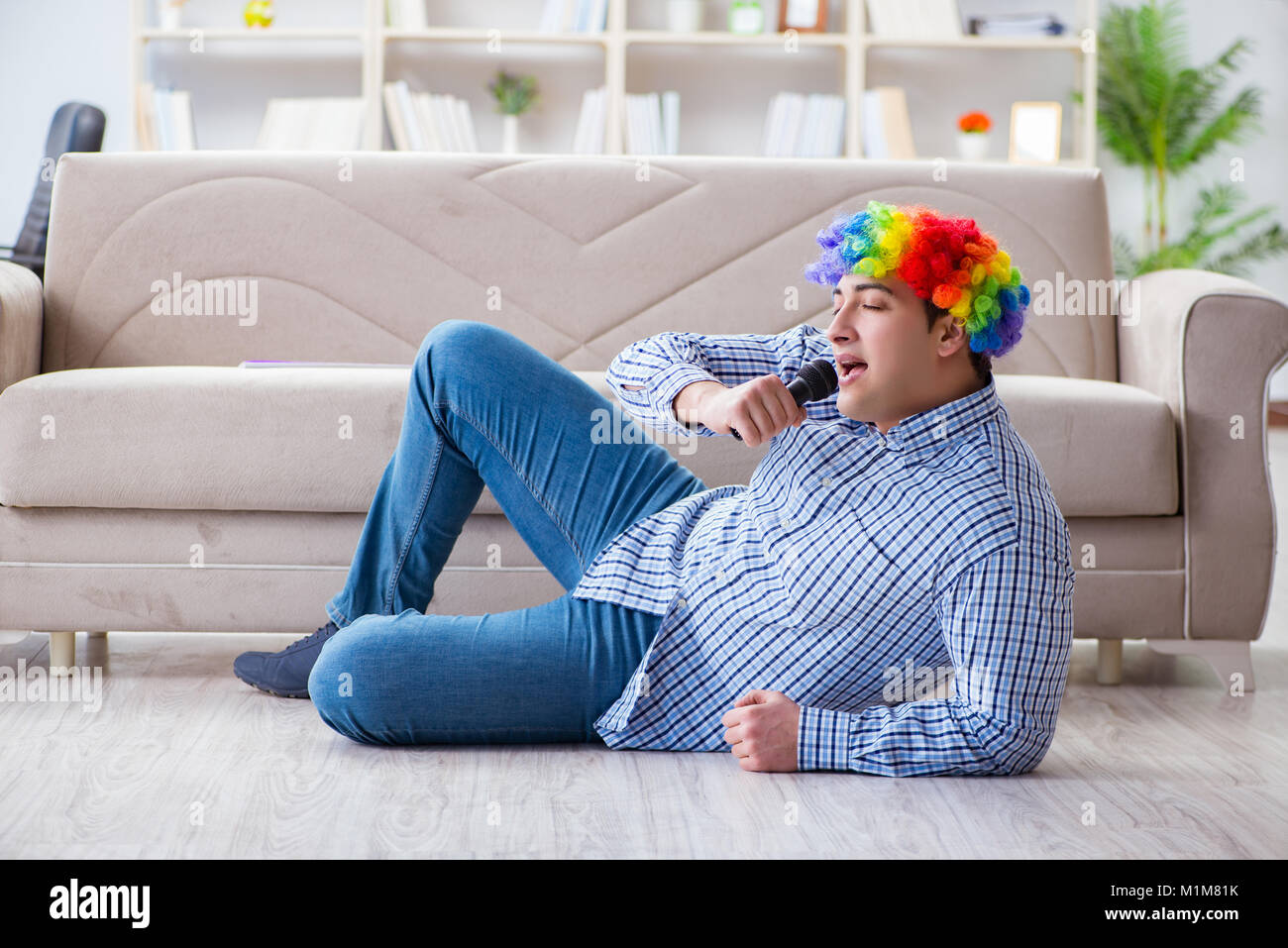 Funny man singing songs in karaoke at home Stock Photo - Alamy