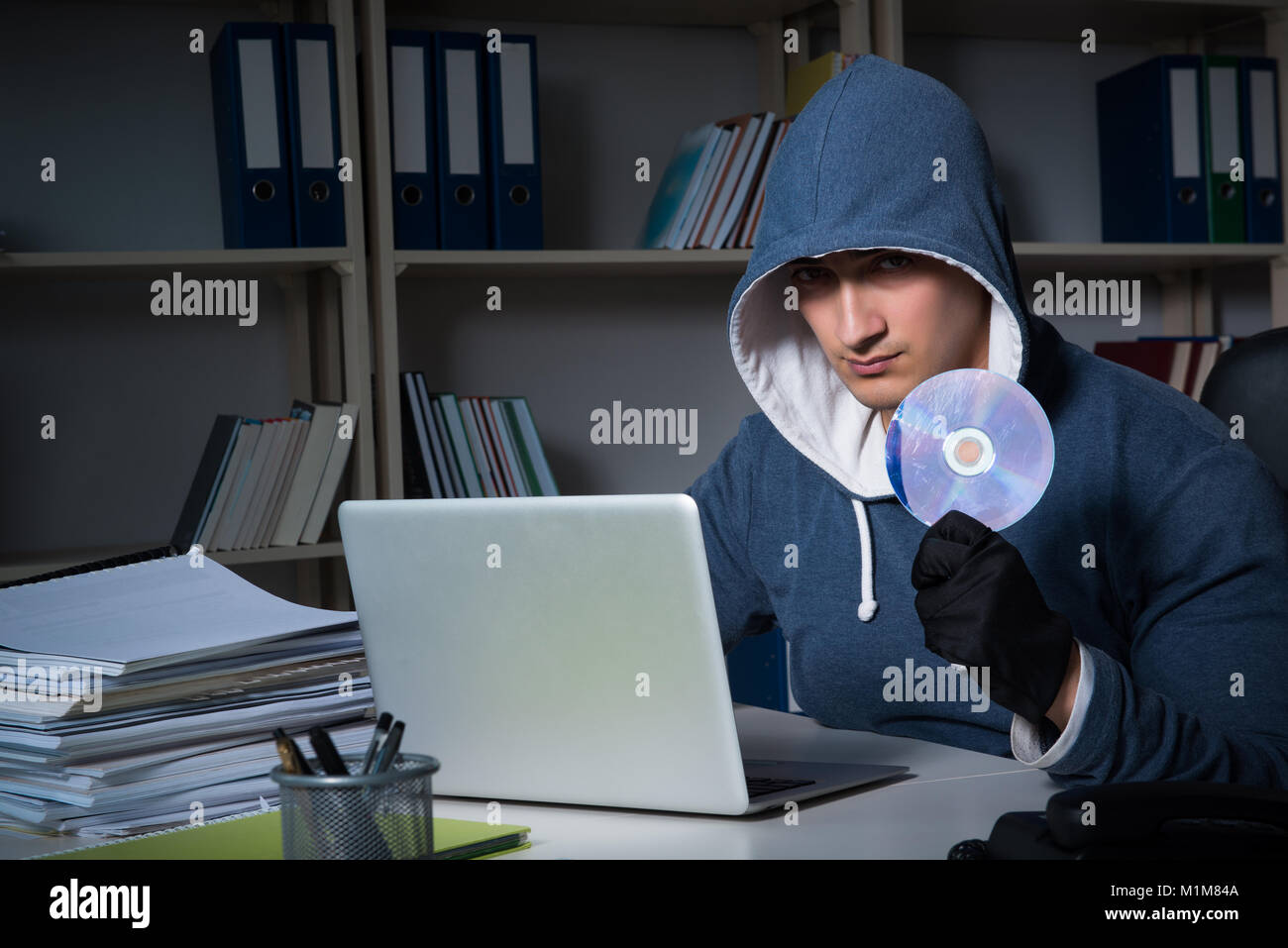 Young hacker hacking into computer at night Stock Photo - Alamy