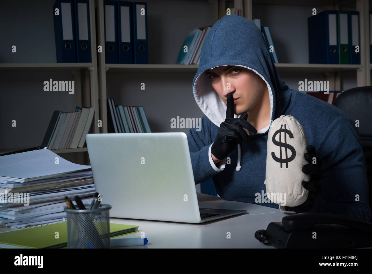 Young hacker hacking into computer at night Stock Photo - Alamy