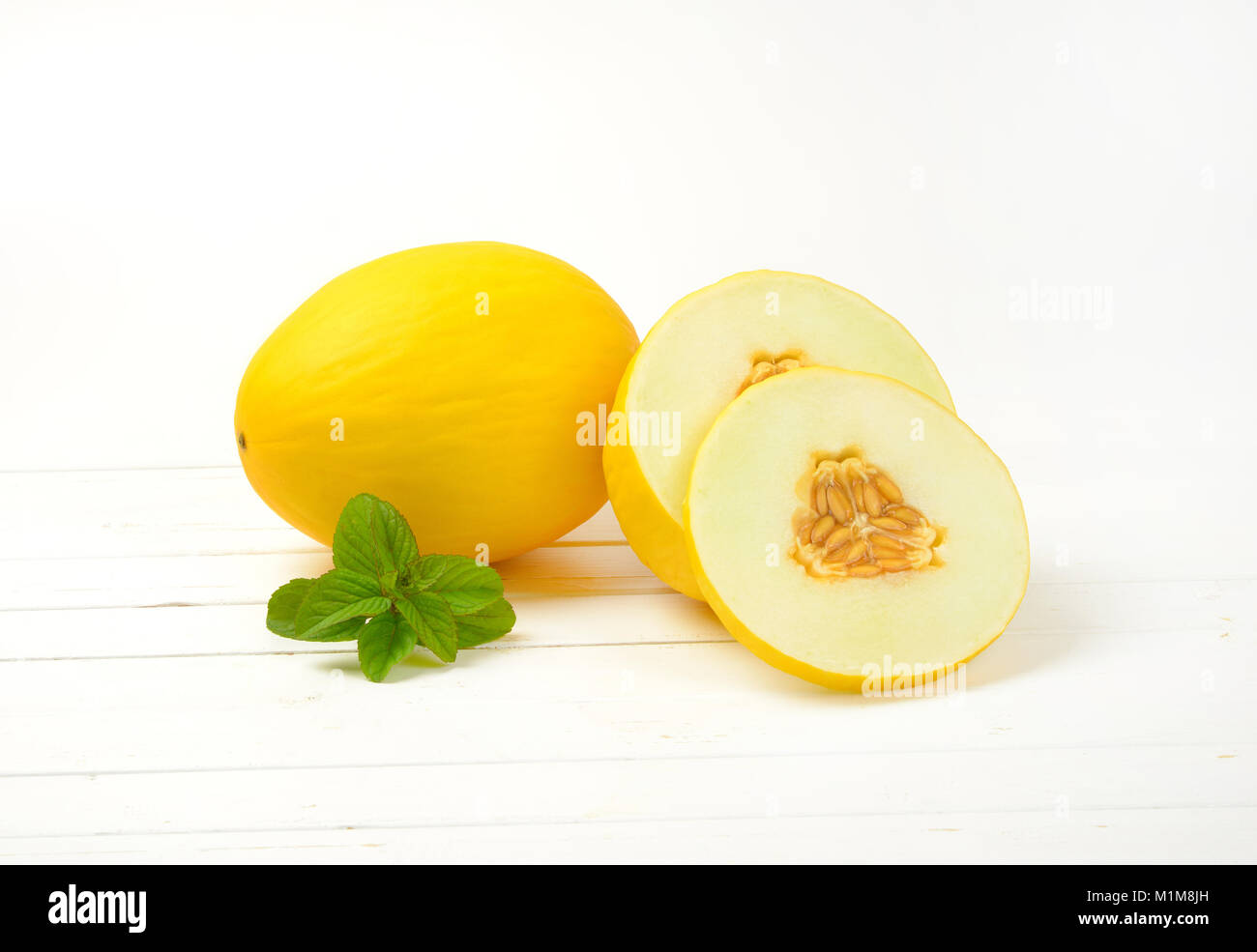 fresh yellow melons - whole, half and slice Stock Photo - Alamy