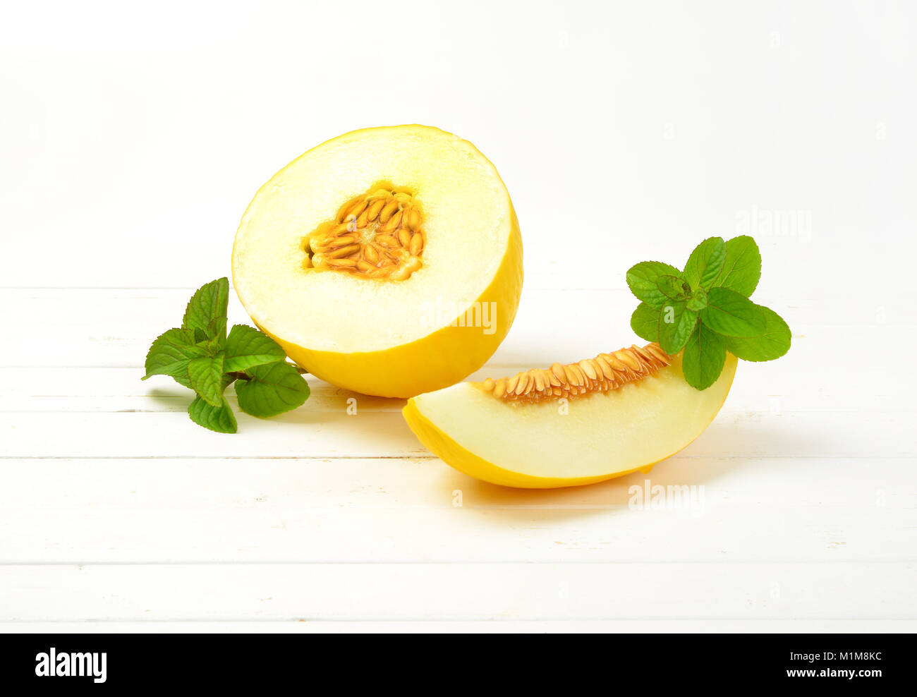 half and slice of yellow melon Stock Photo - Alamy