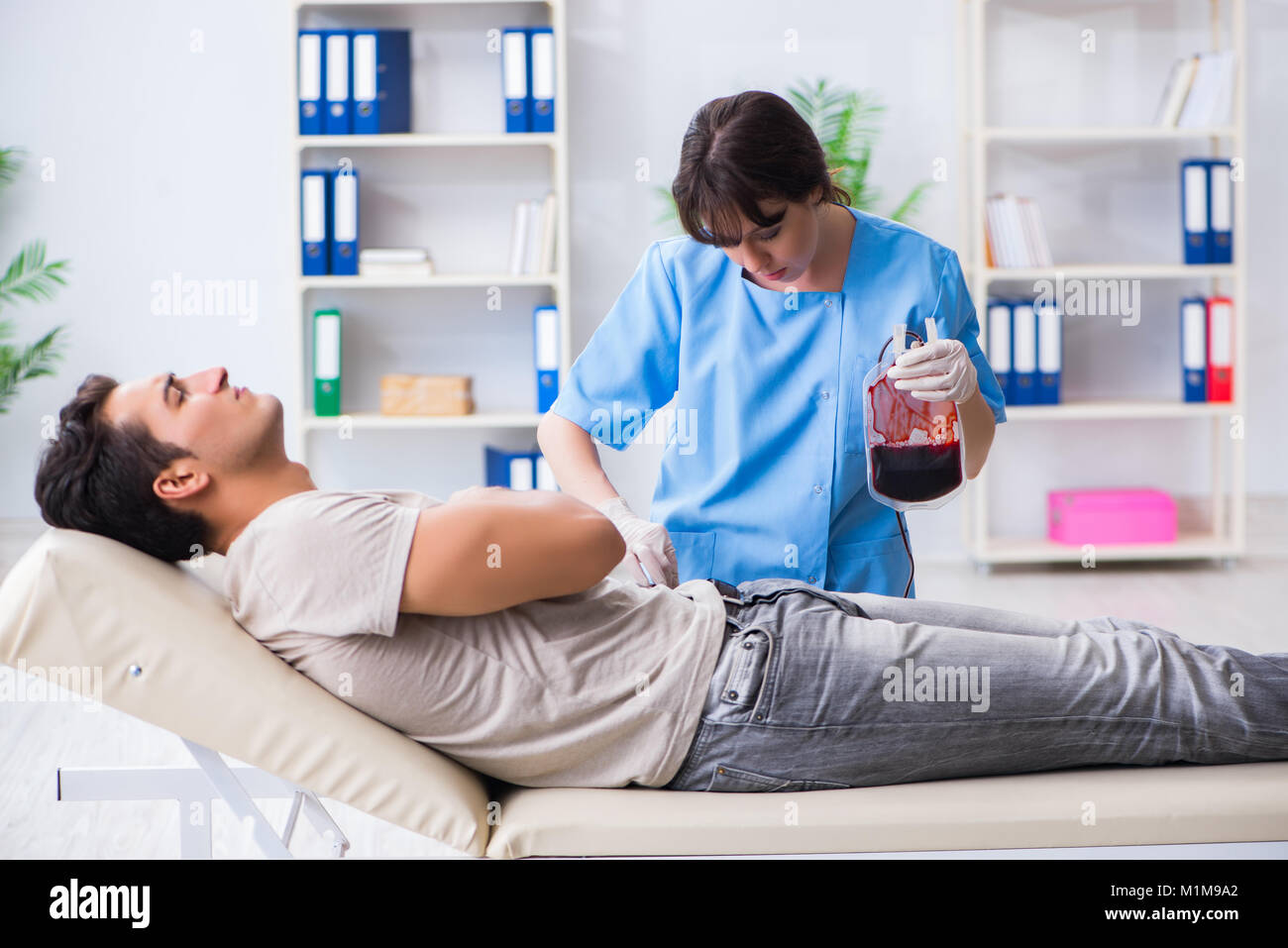 Patient getting blood transfusion in hospital clinic Stock Photo - Alamy