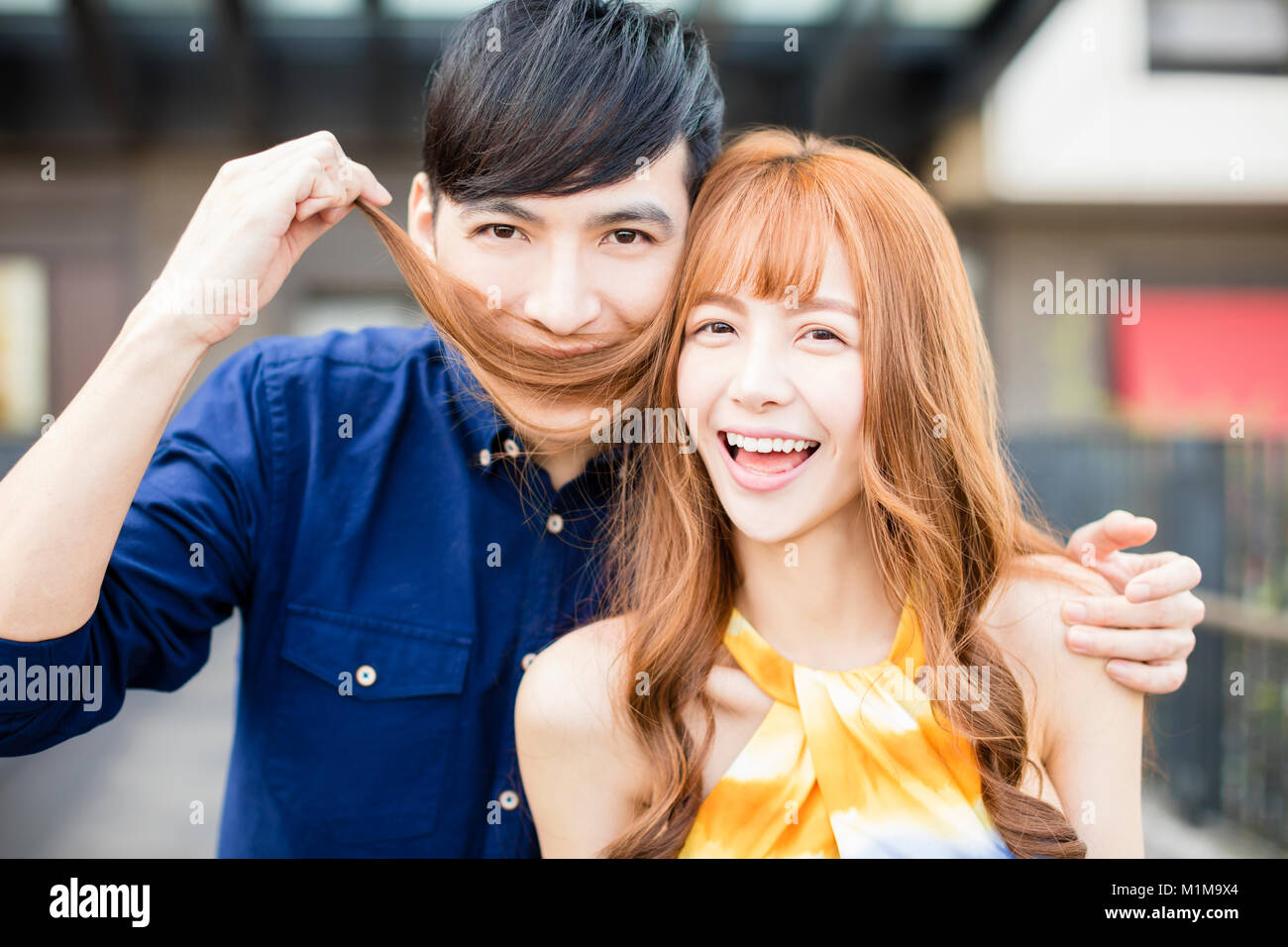 Young woman man happy moustache hi-res stock photography and images - Alamy