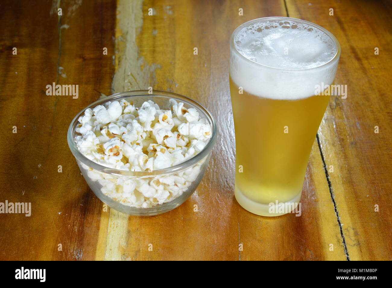 popcorn in cup eat with beer on table Stock Photo - Alamy