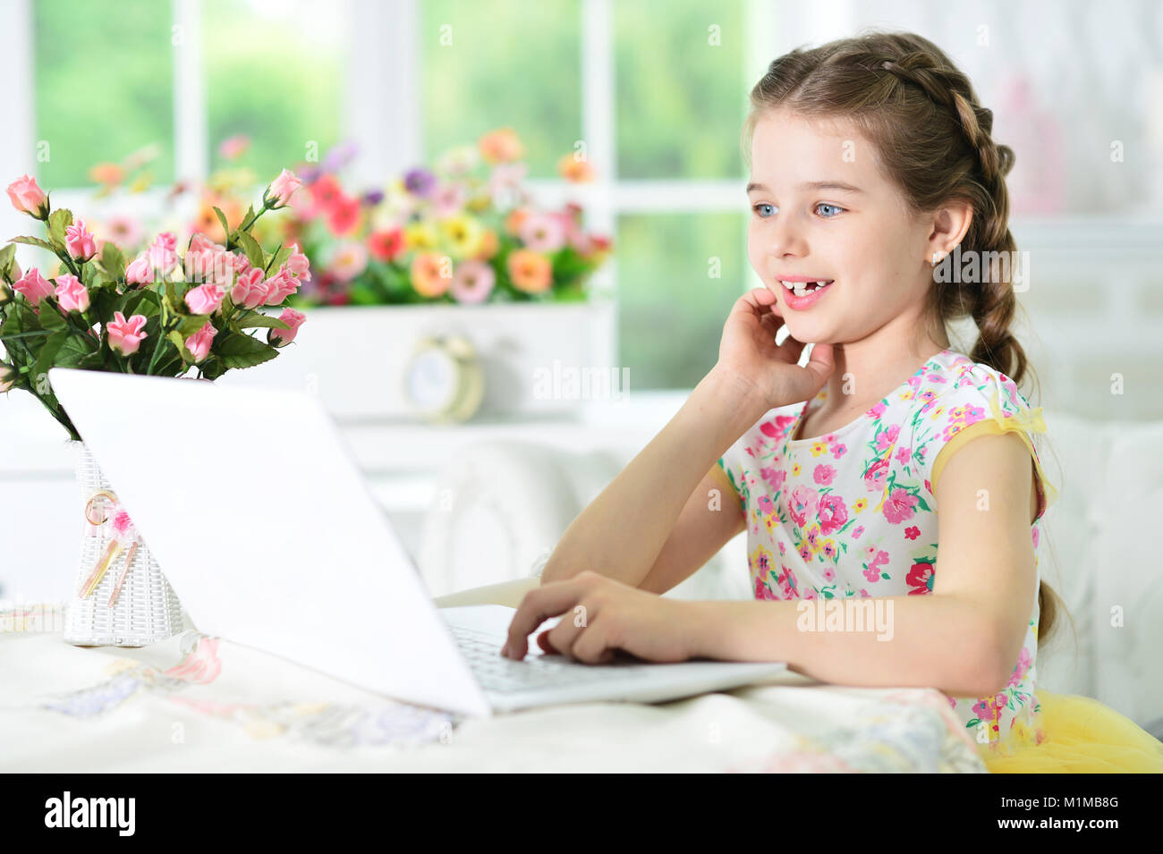 little girl using laptop Stock Photo - Alamy