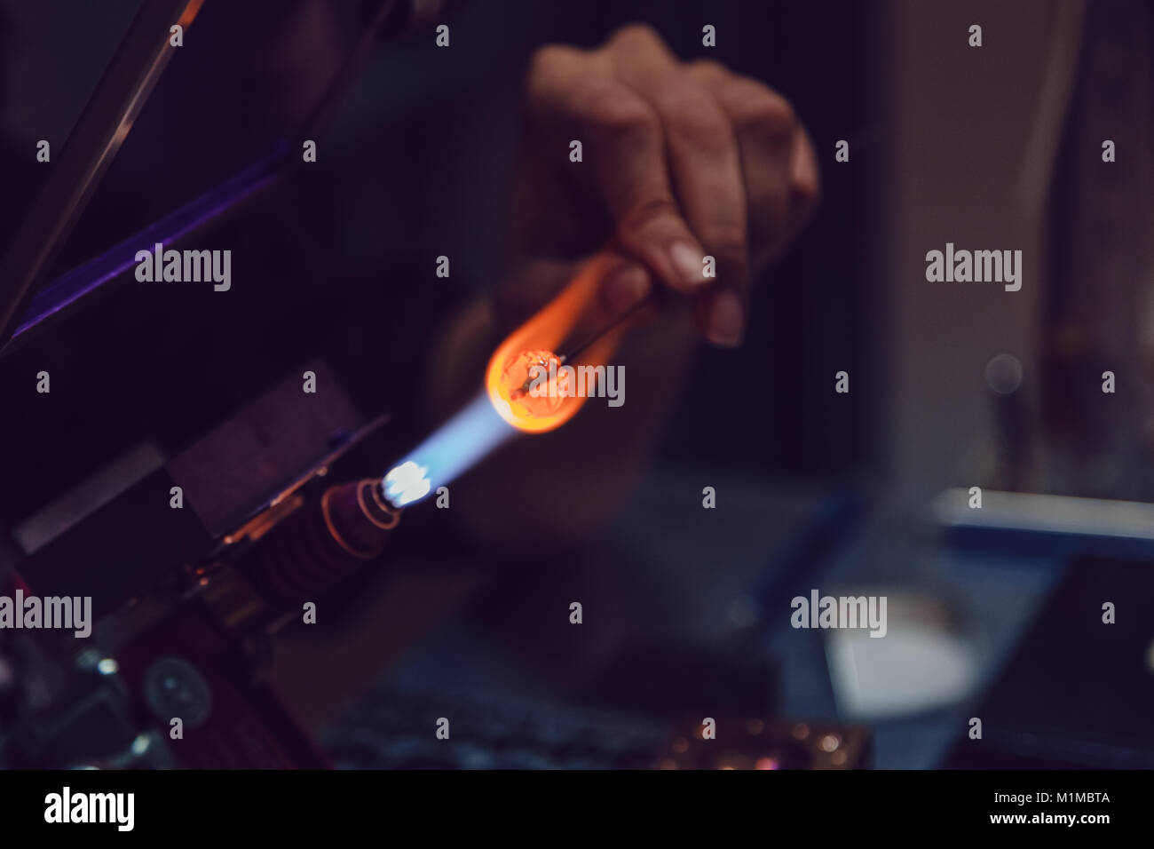 Process of manufacturing costume jewelery from Venetian glass Stock ...