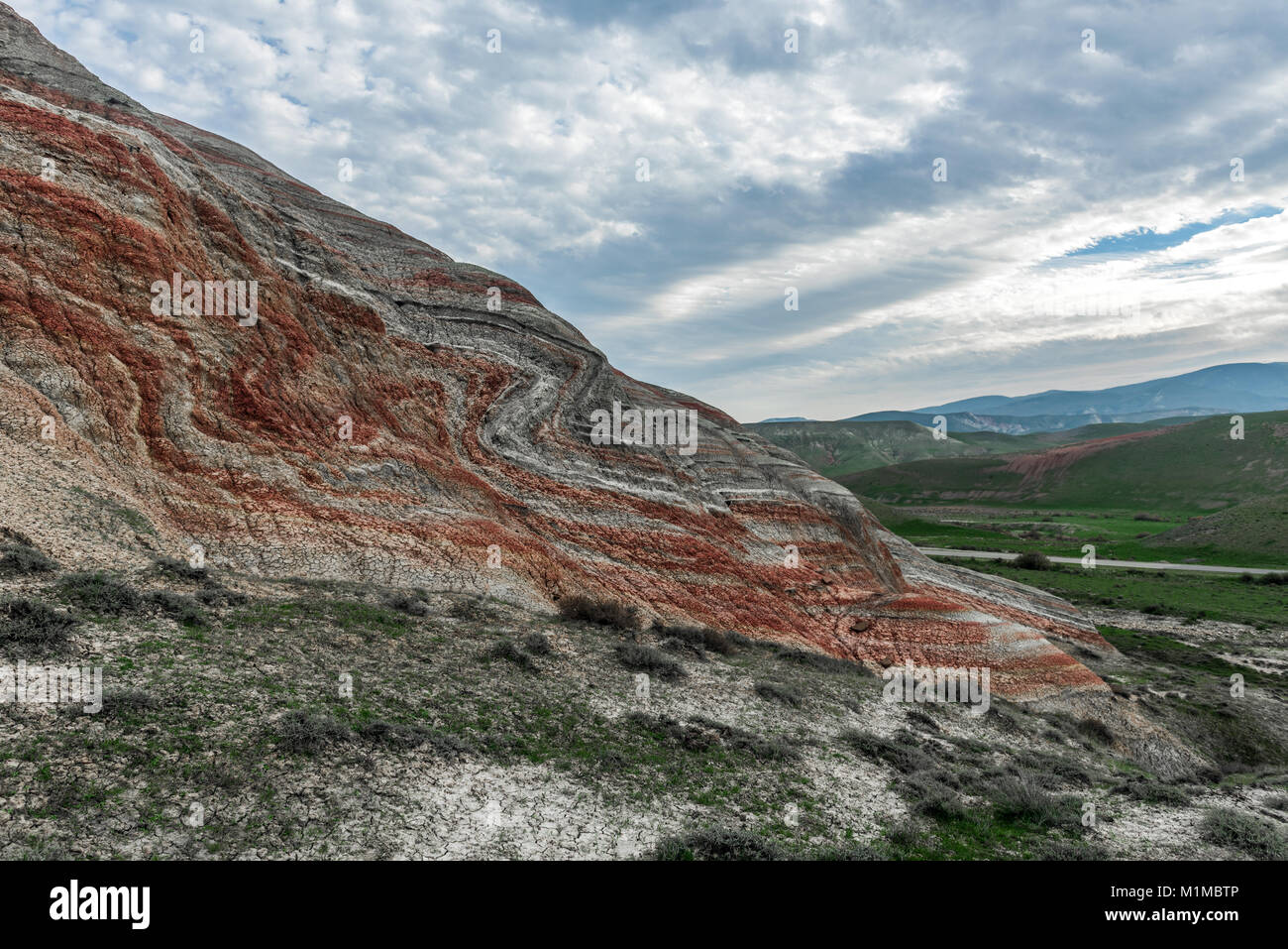Amazing striped red mountains Stock Photo - Alamy